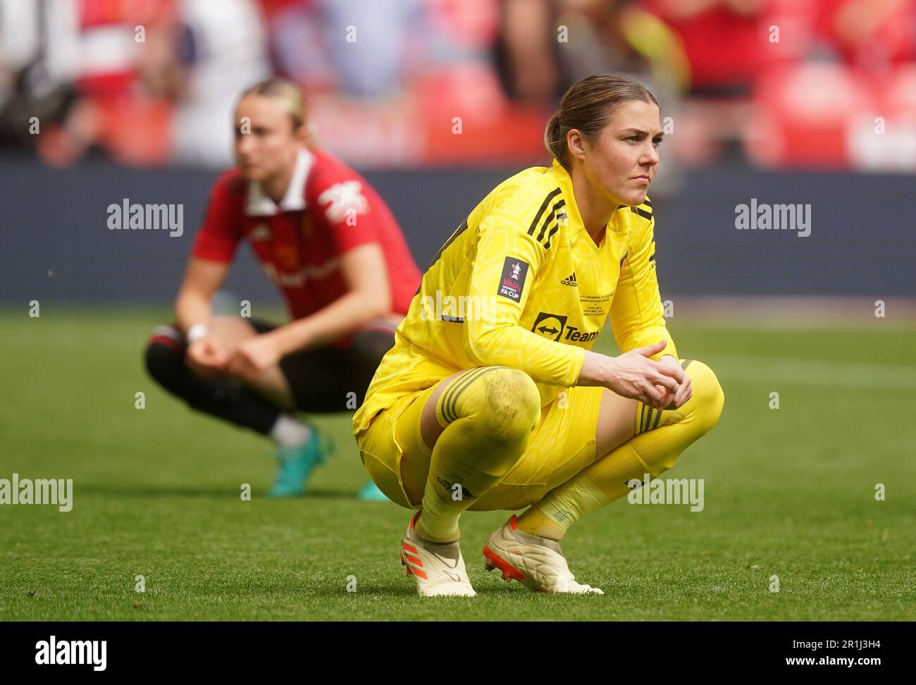 Manchester United goalkeeper Mary Earps (right) reacts following the ...