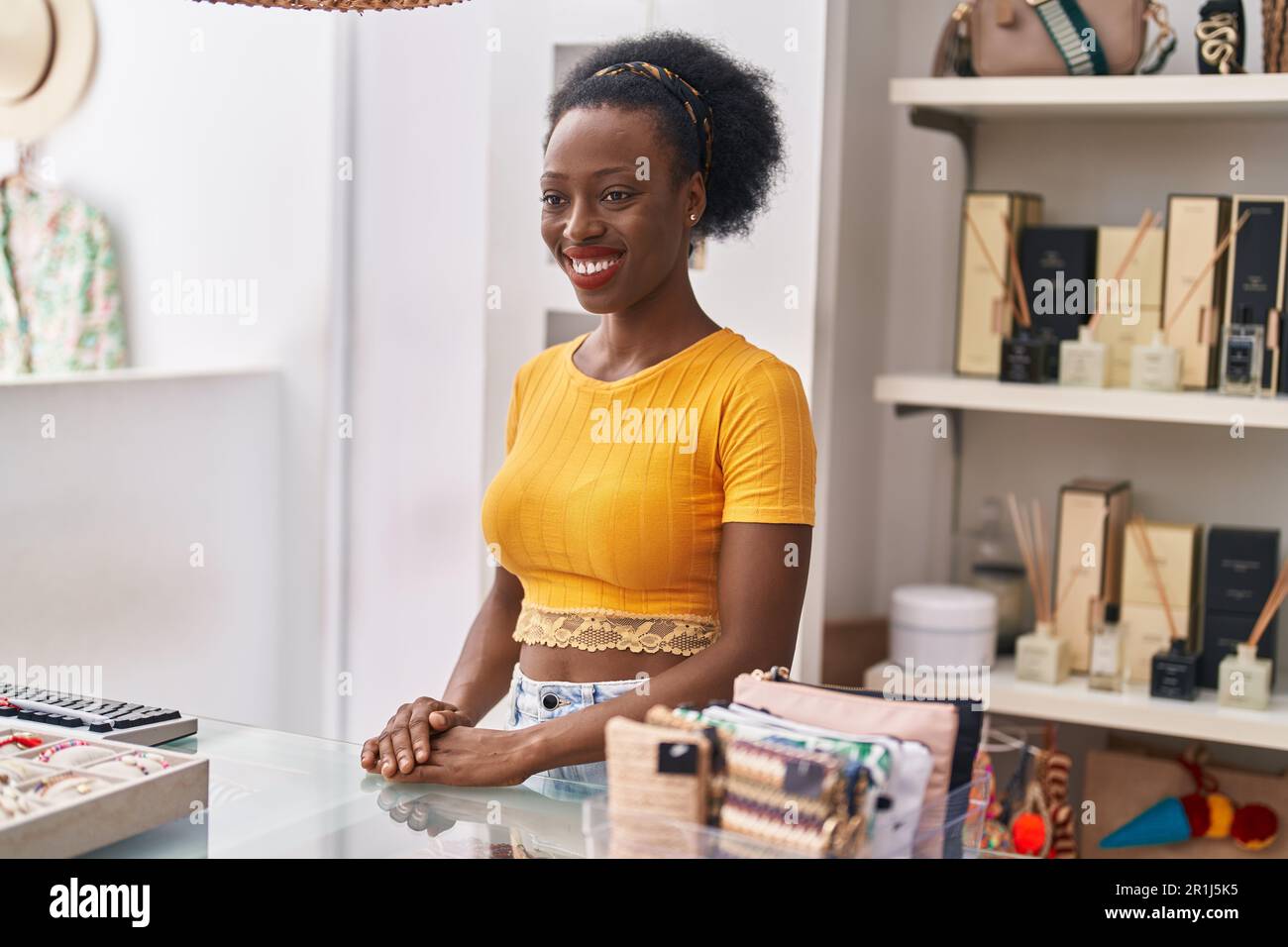 African american woman shop assistant using computer working at ...