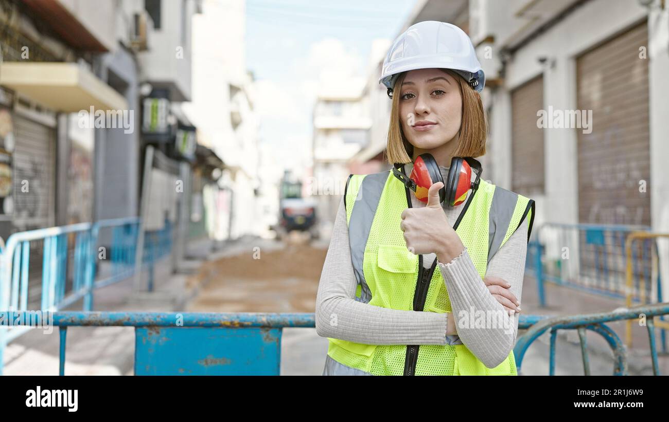 Female architect standing thumb hi-res stock photography and images - Alamy