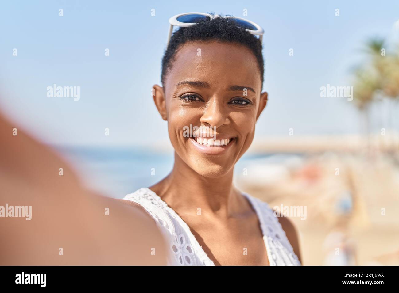 African american woman smiling confident making selfie by camera at seaside Stock Photo - Alamy