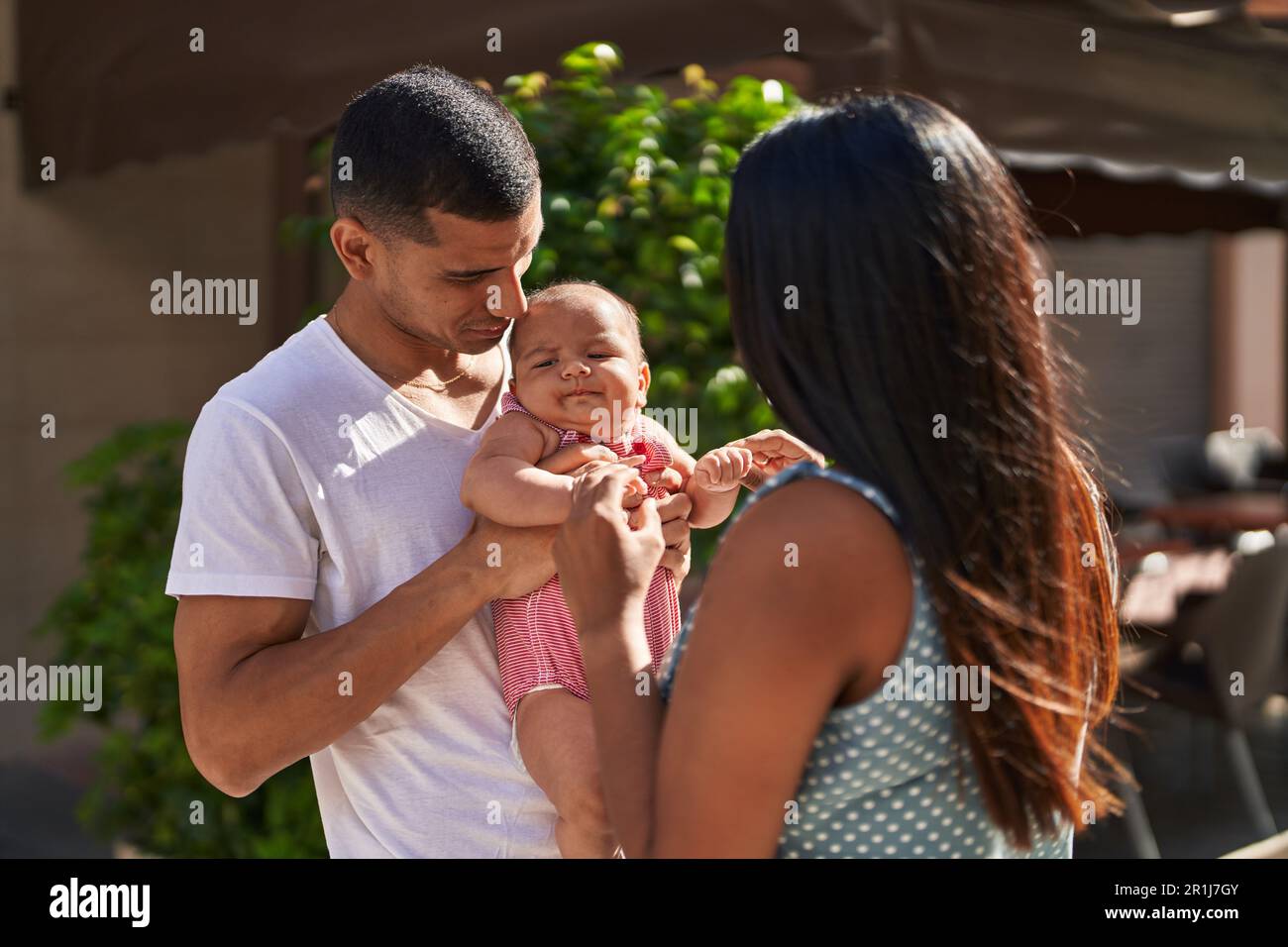 Hispanic family smiling confident hugging each other at street Stock ...