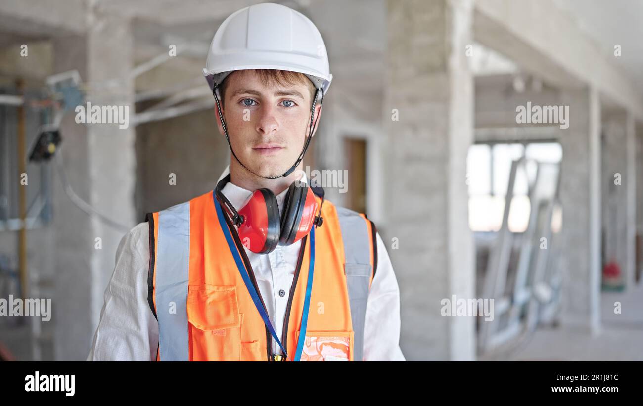 Young caucasian man architect standing with relaxed expression at ...