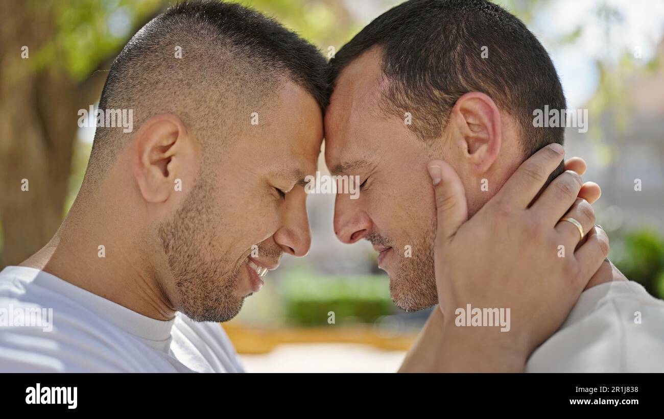 Two men couple smiling confident standing together at park Stock Photo ...