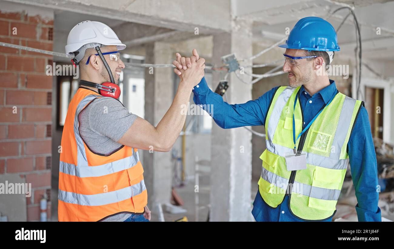 Builders hands together hi-res stock photography and images - Alamy