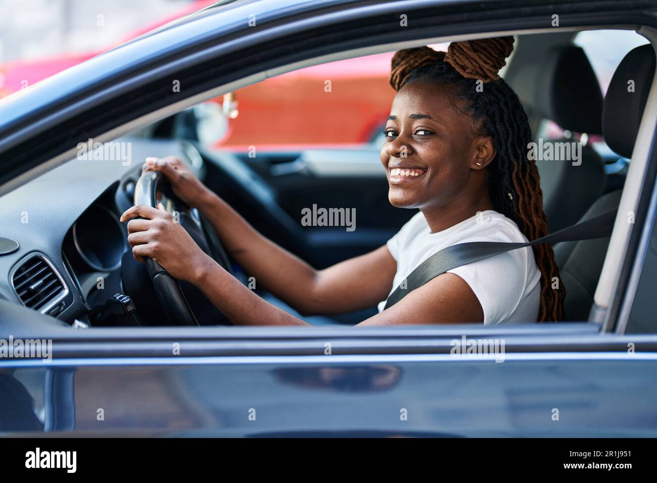 African american woman smiling confident driving car at street Stock ...