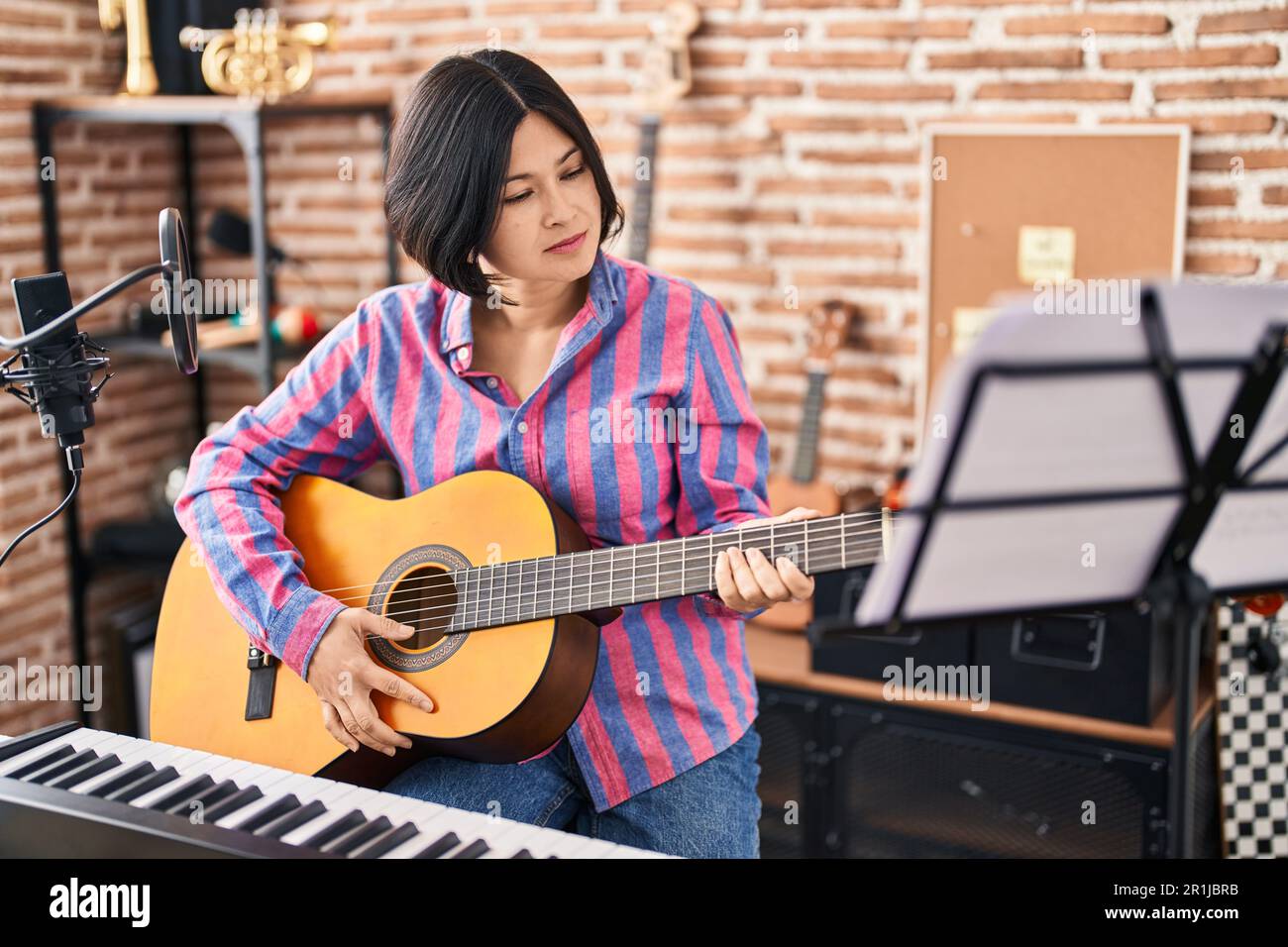 Asian female singer playing guitar hi-res stock photography and images ...