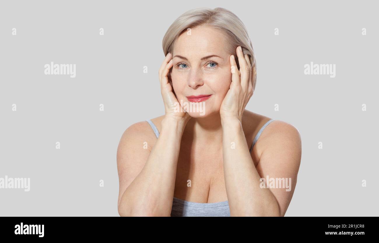 This gorgeous middle-aged blonde woman flaunts her flawlessly groomed ...