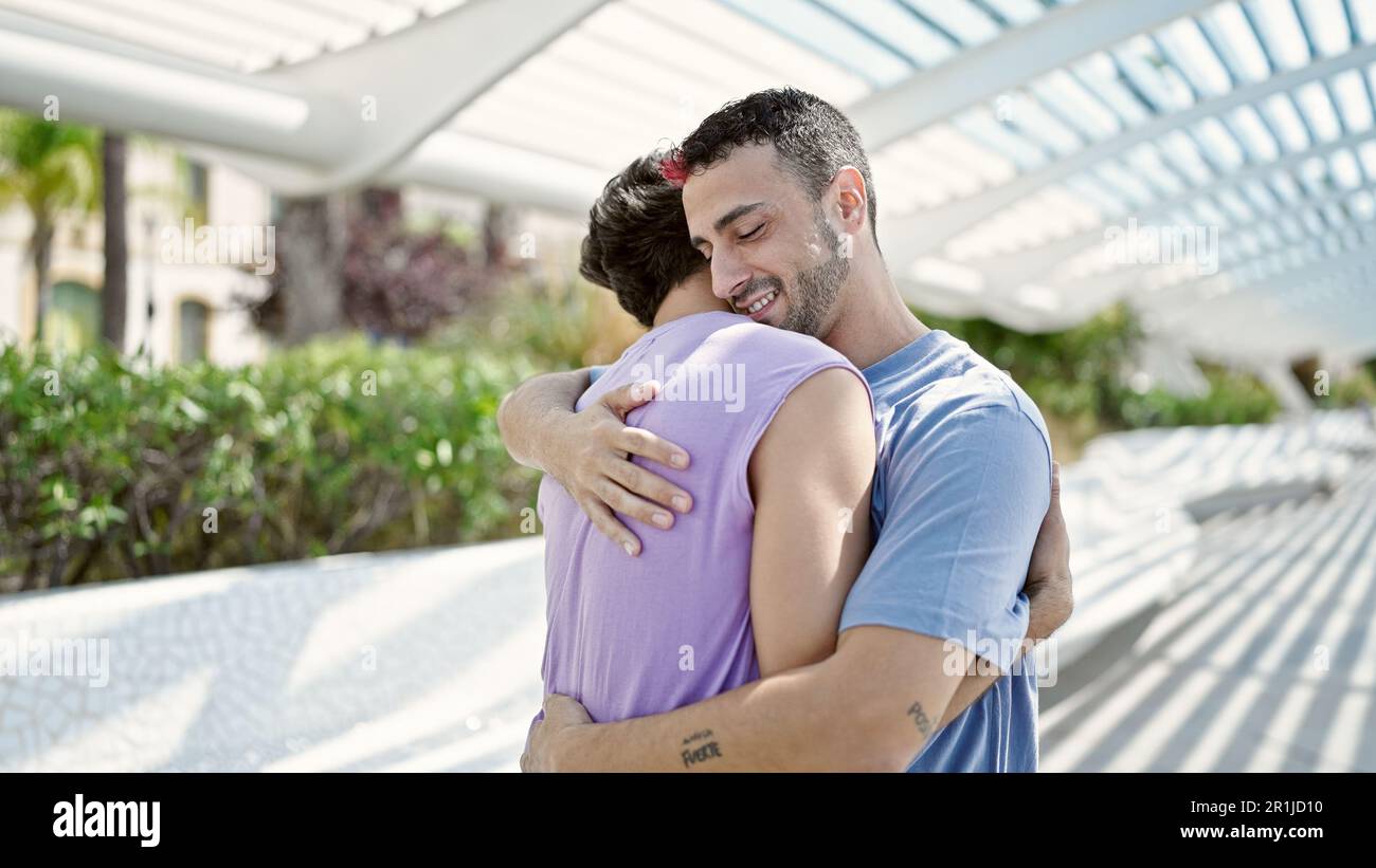 Two men couple smiling confident hugging each other at park Stock Photo ...