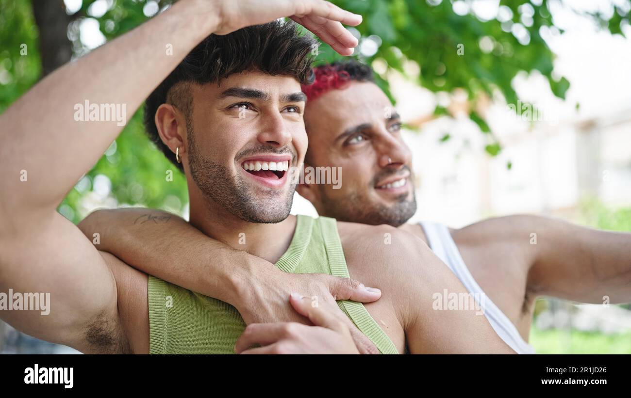 Two men couple smiling confident hugging each other at park Stock Photo ...