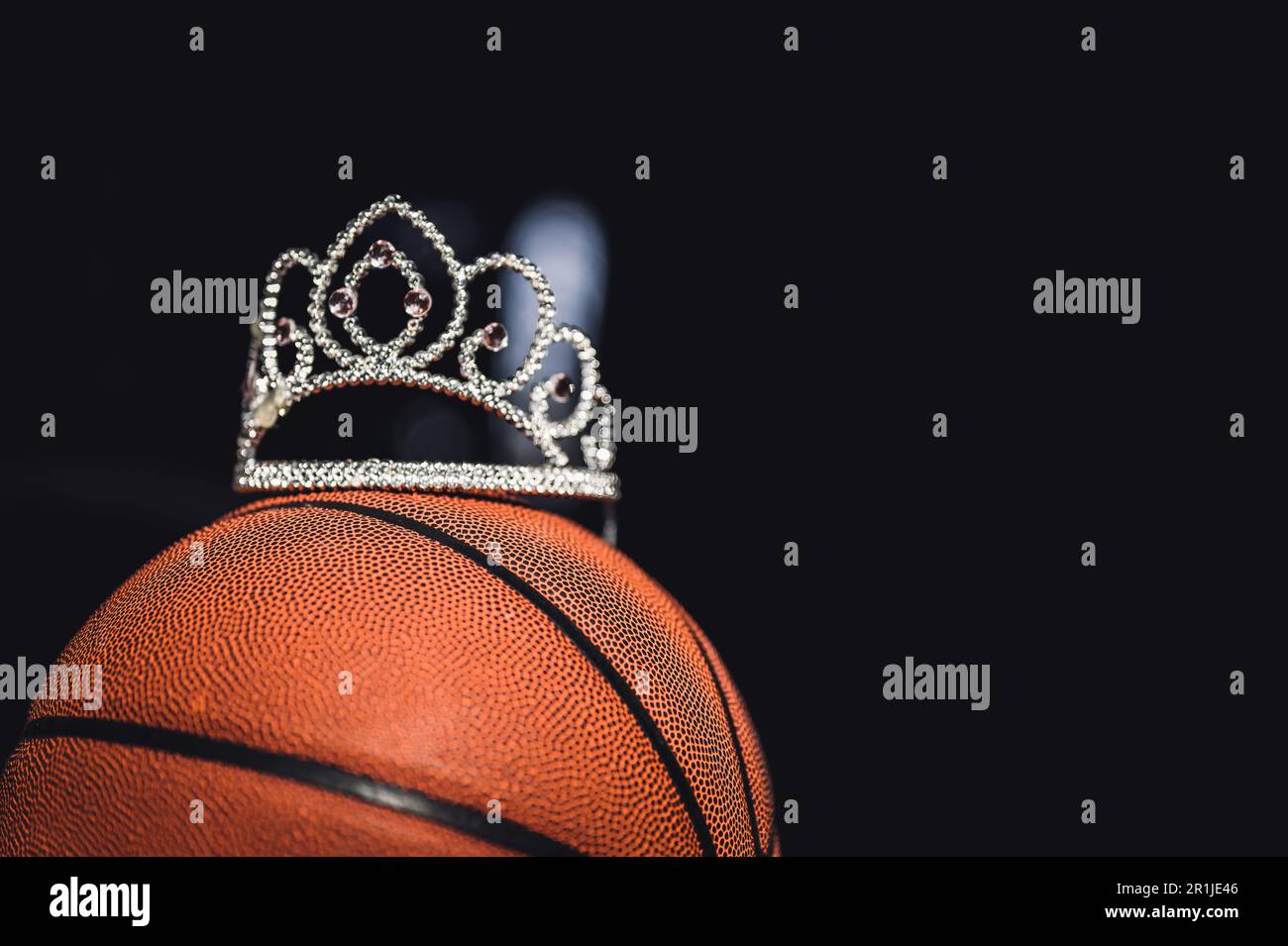 Basketball, tiara, and blank bracket signifying a Cinderella season ...