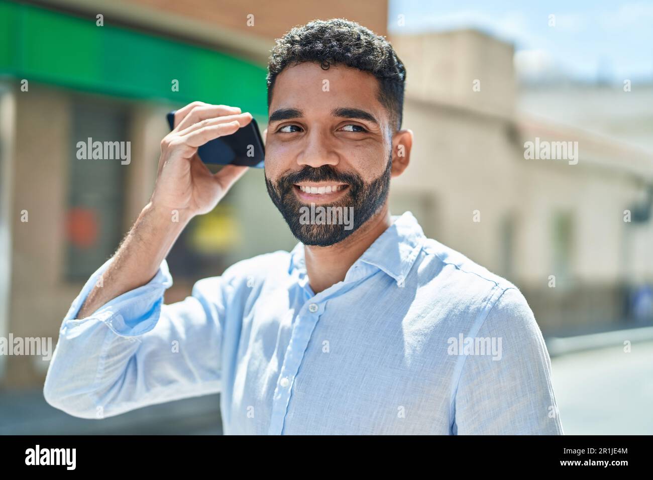 Young arab man miling confident hi-res stock photography and images - Alamy
