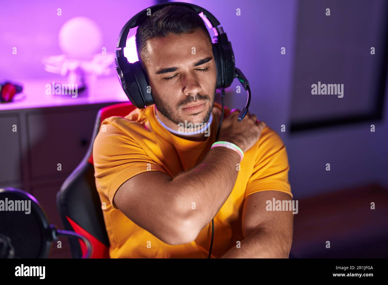 Young hispanic man streamer stressed using computer at gaming room ...