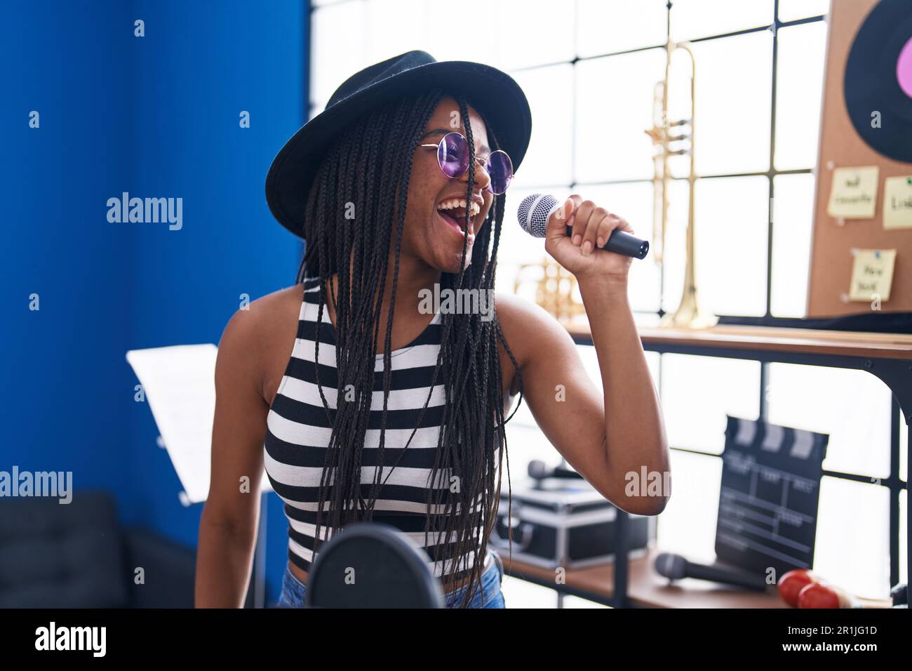 African american woman artist singing song at music studio Stock Photo ...