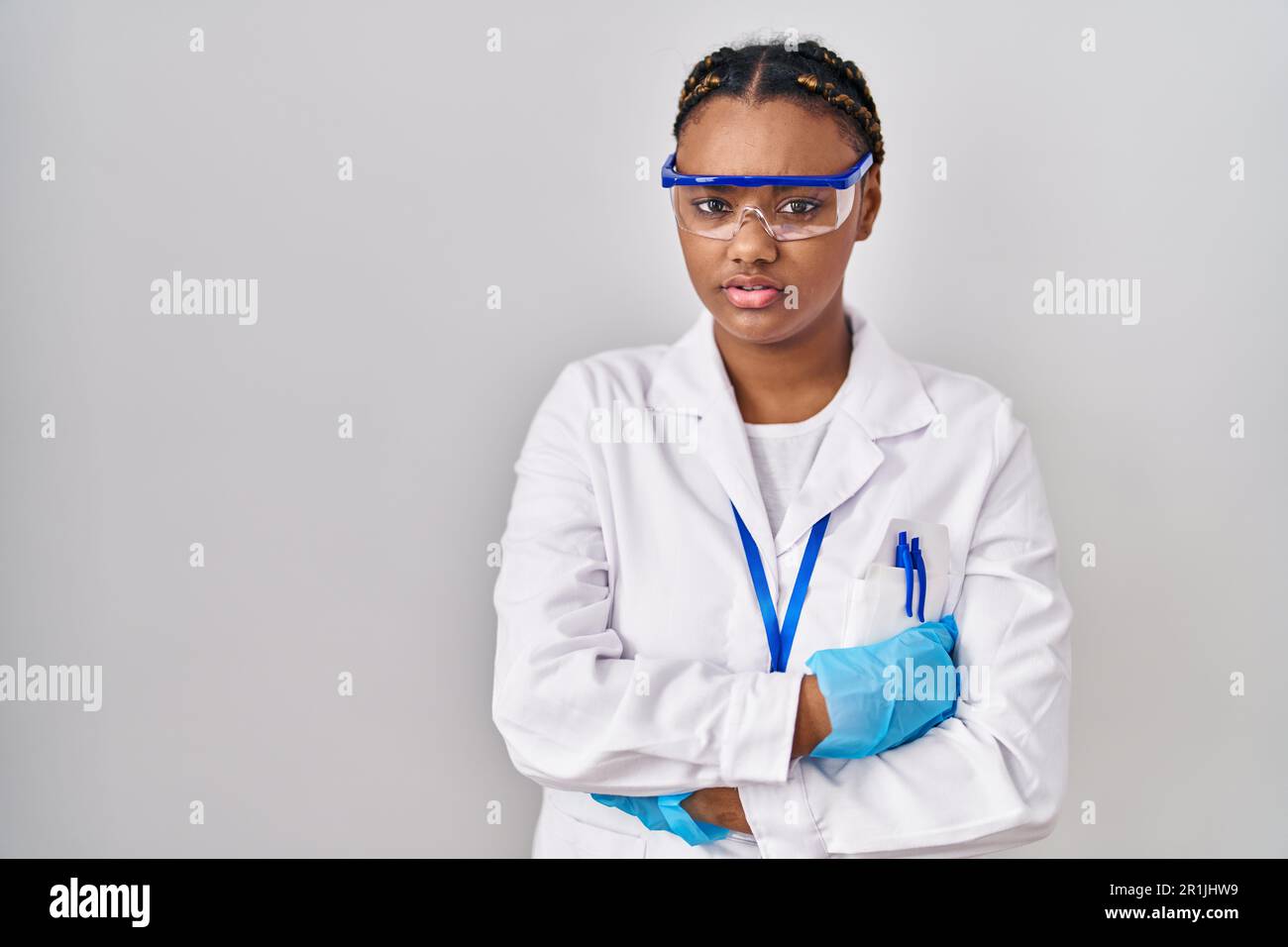 African american woman with braids wearing scientist robe skeptic and ...