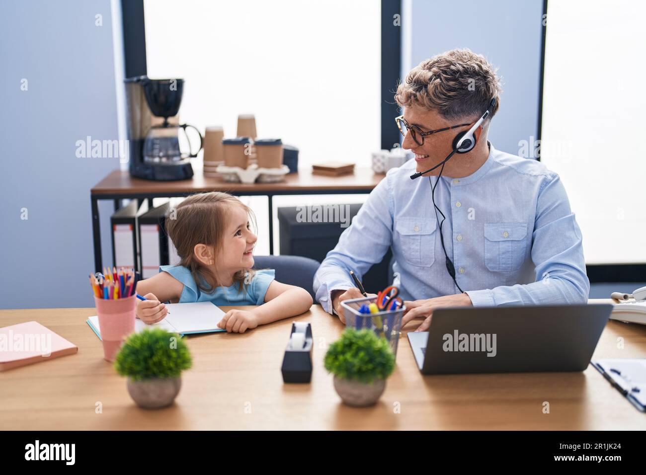 Father and daughter call center agent and student studying and working ...