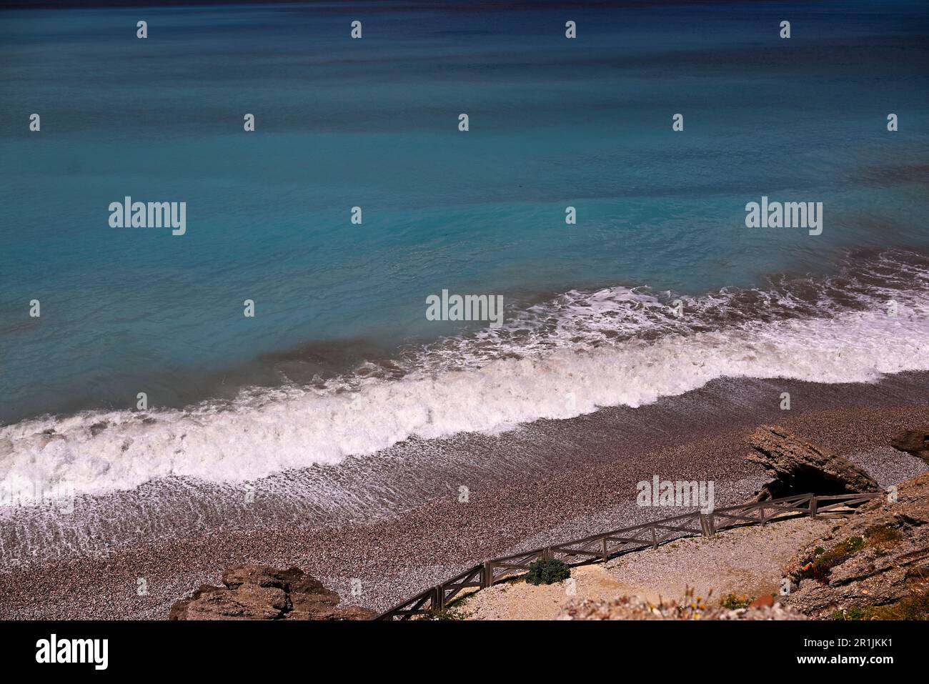 Sea coast of the Mediterranean. Shoreline with pebble beach and white ...
