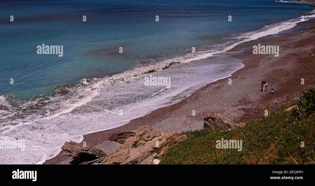 Sea coast of the Mediterranean. Shoreline with pebble beach and white ...