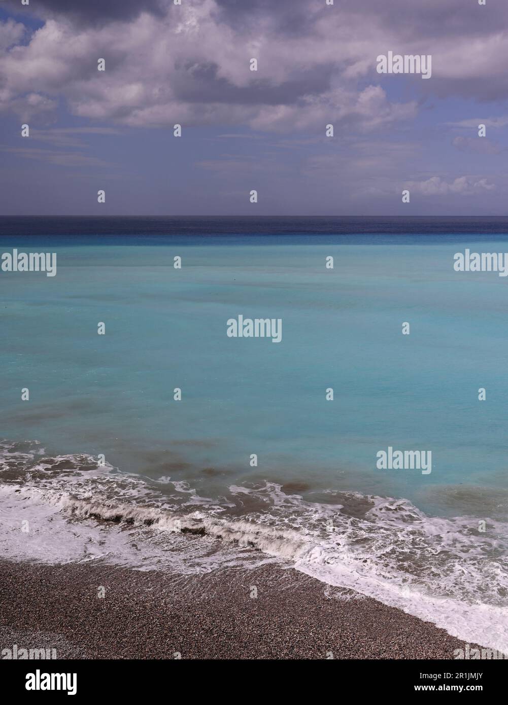 Sea coast of the Mediterranean. Shoreline with pebble beach and white ...