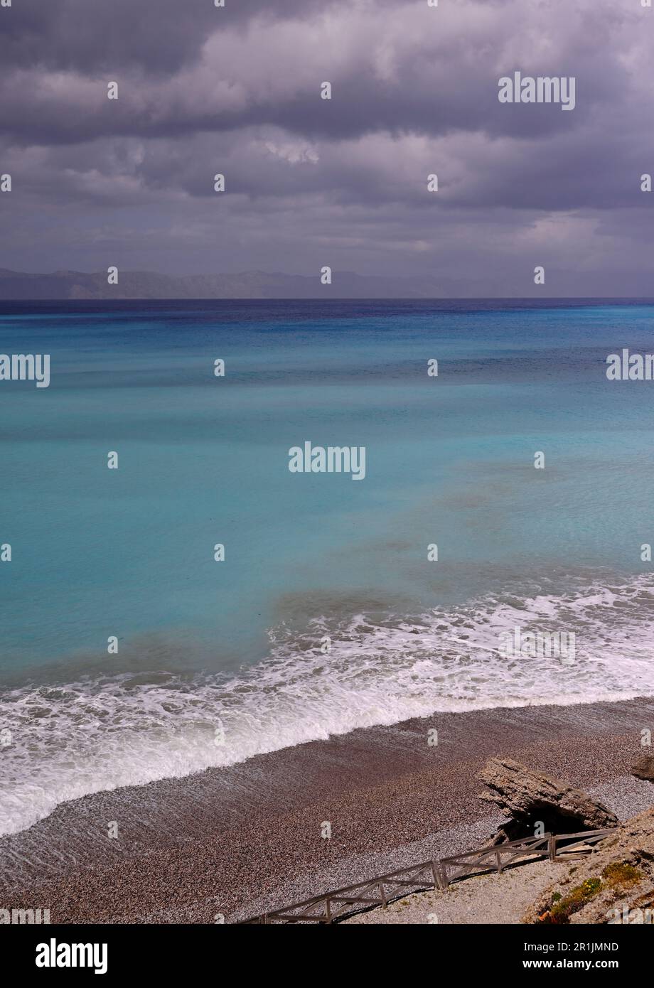 Sea coast of the Mediterranean. Shoreline with pebble beach and white ...