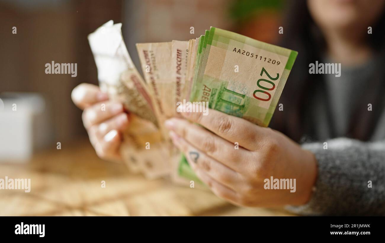 Hands of woman counting russian ruble banknotes at room Stock Photo - Alamy