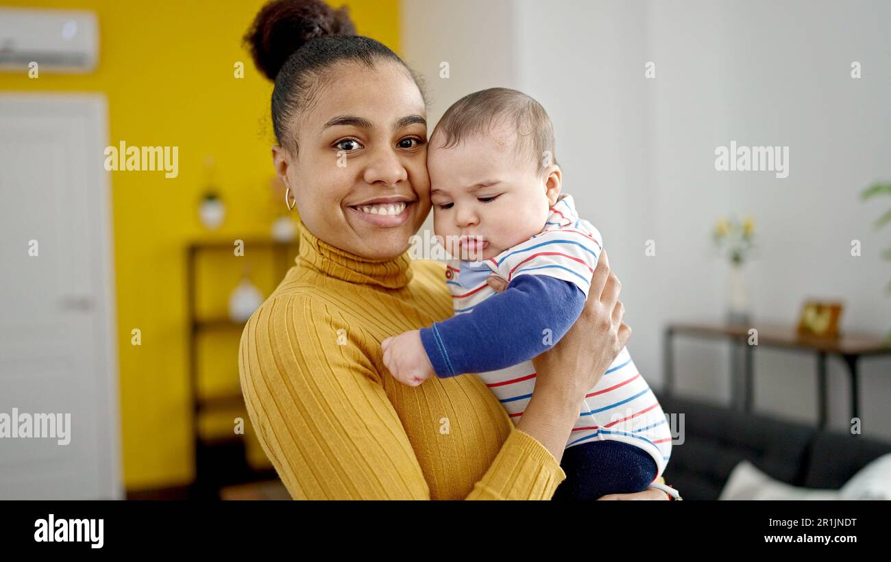 Mother and son smiling confident hugging each other at home Stock Photo ...