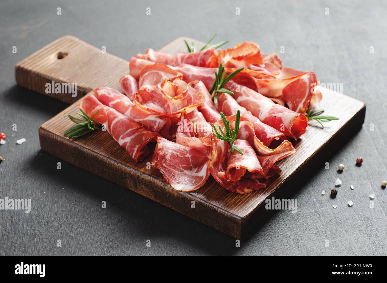 Cured Meat Platter, Antipasto, Appetizer on a Boardover Dark Background ...