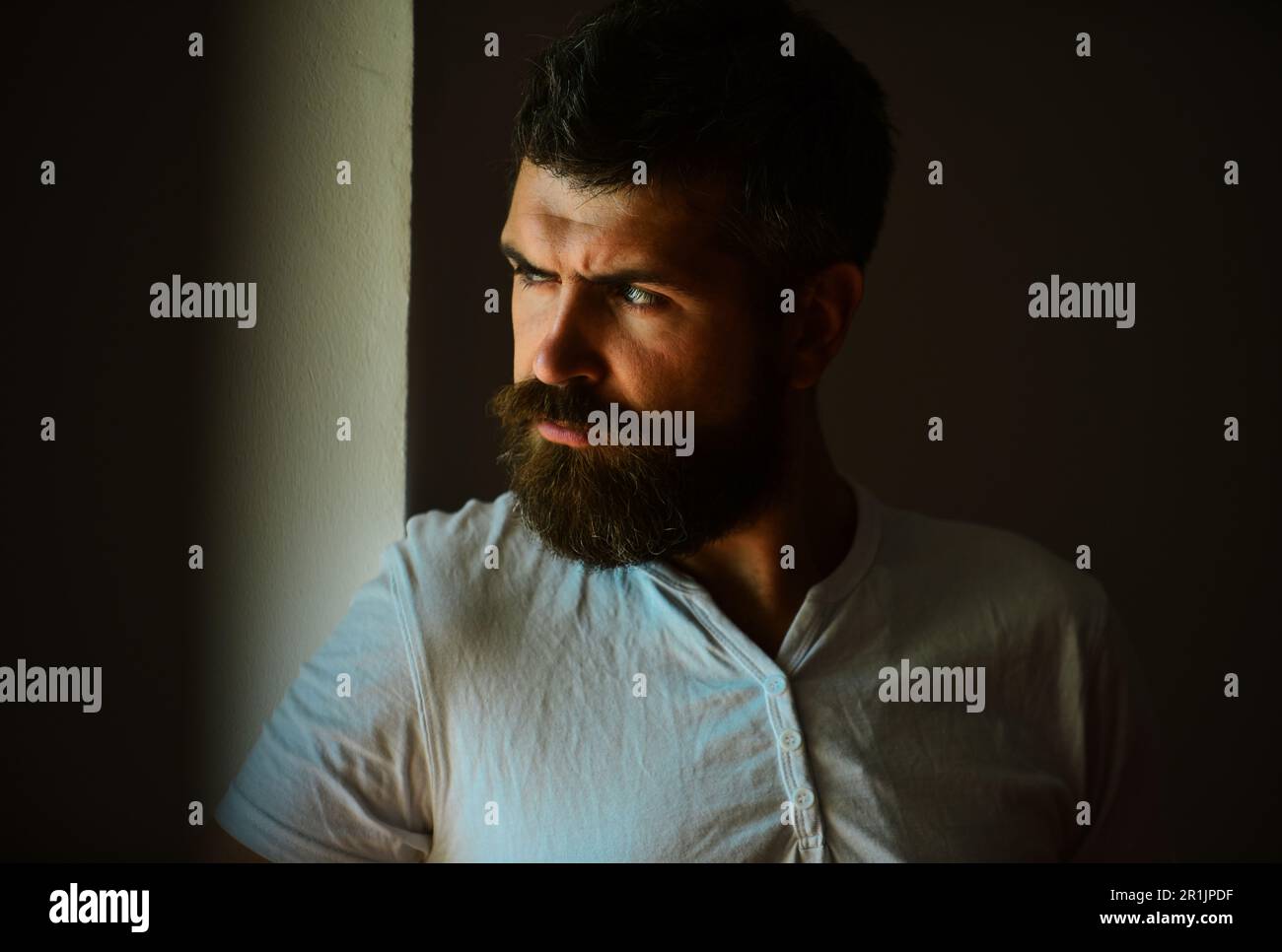 Shadow male face. Close up portrait of guy with serious profile face ...