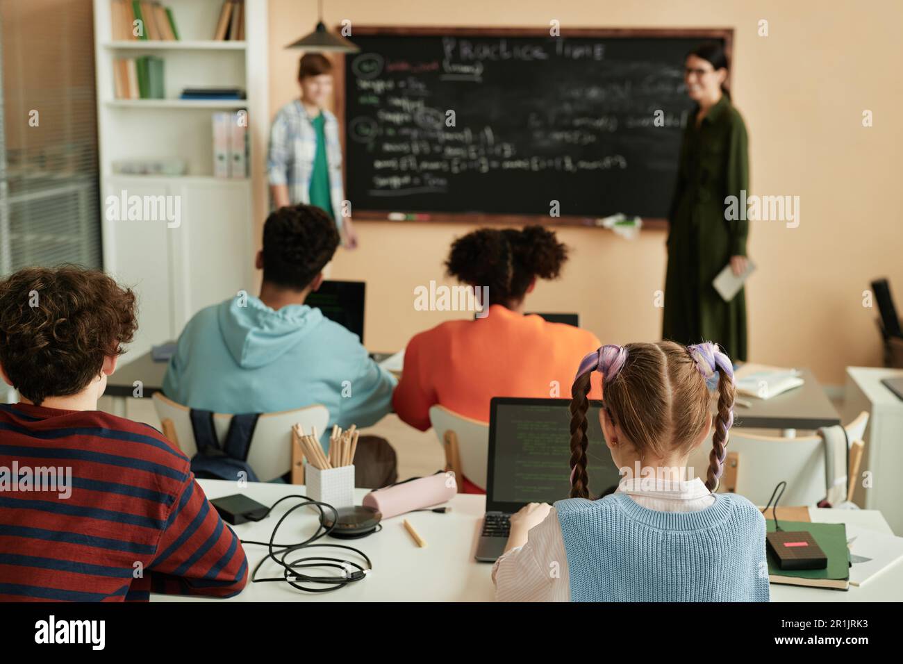 Back view diverse student coding hi-res stock photography and images ...
