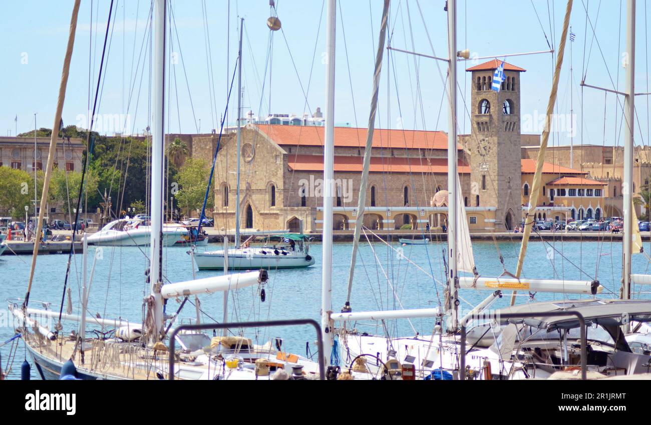 Sea antique port of the island of Rhodes. Sailing yachts are moored at ...