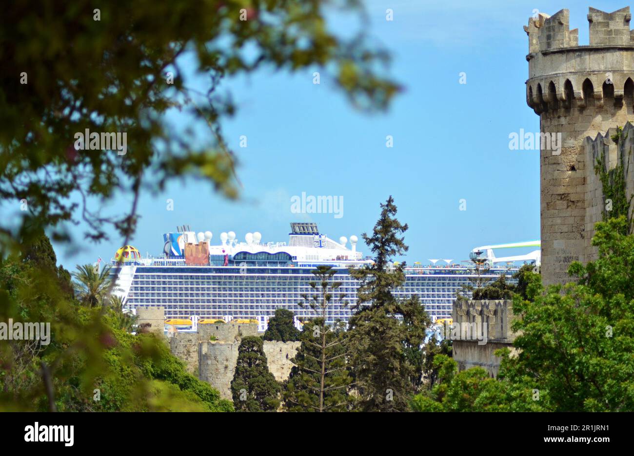 Part of a round medieval palace tower with battlements. On the horizon ...