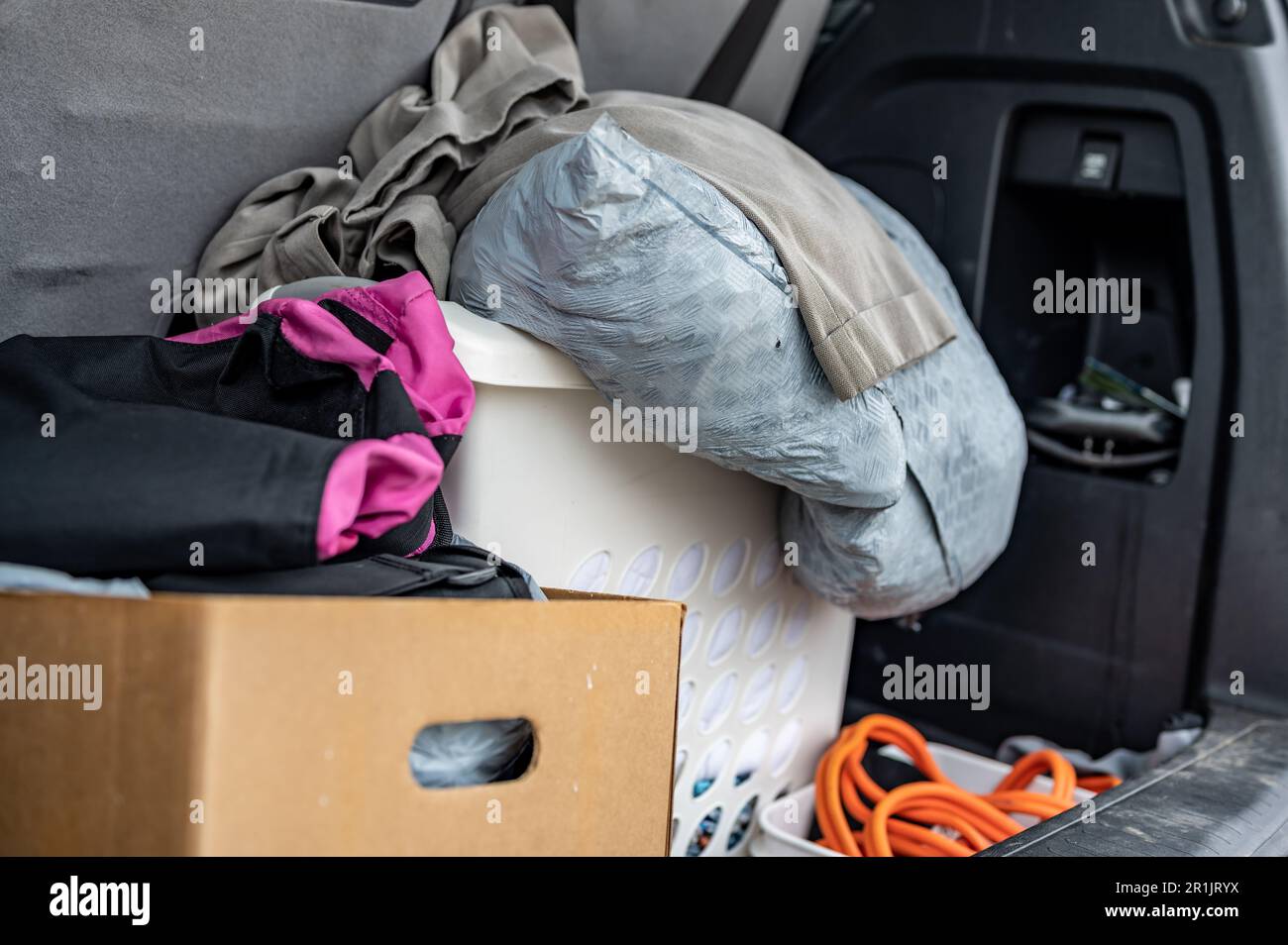 Cloths and material bagged and boxed for donation in the back of a ...