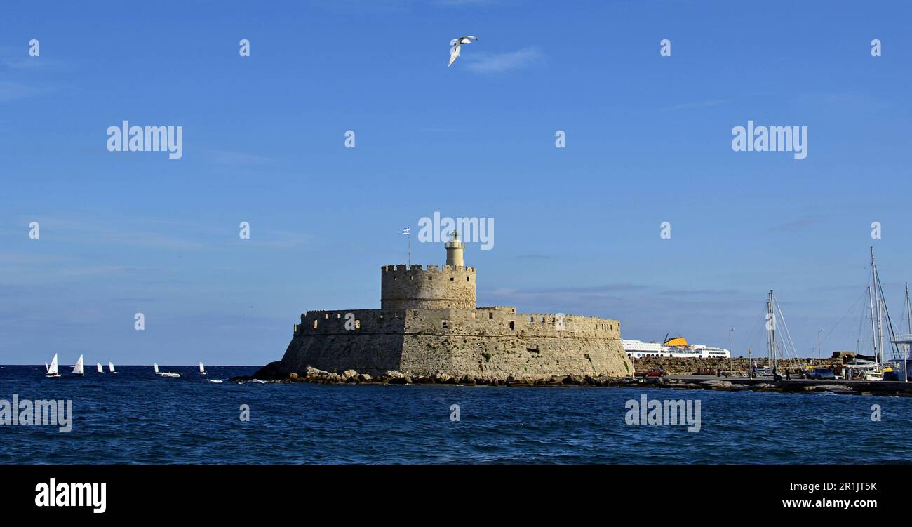 Medieval lighthouse made of stone in the ancient port of the island of ...