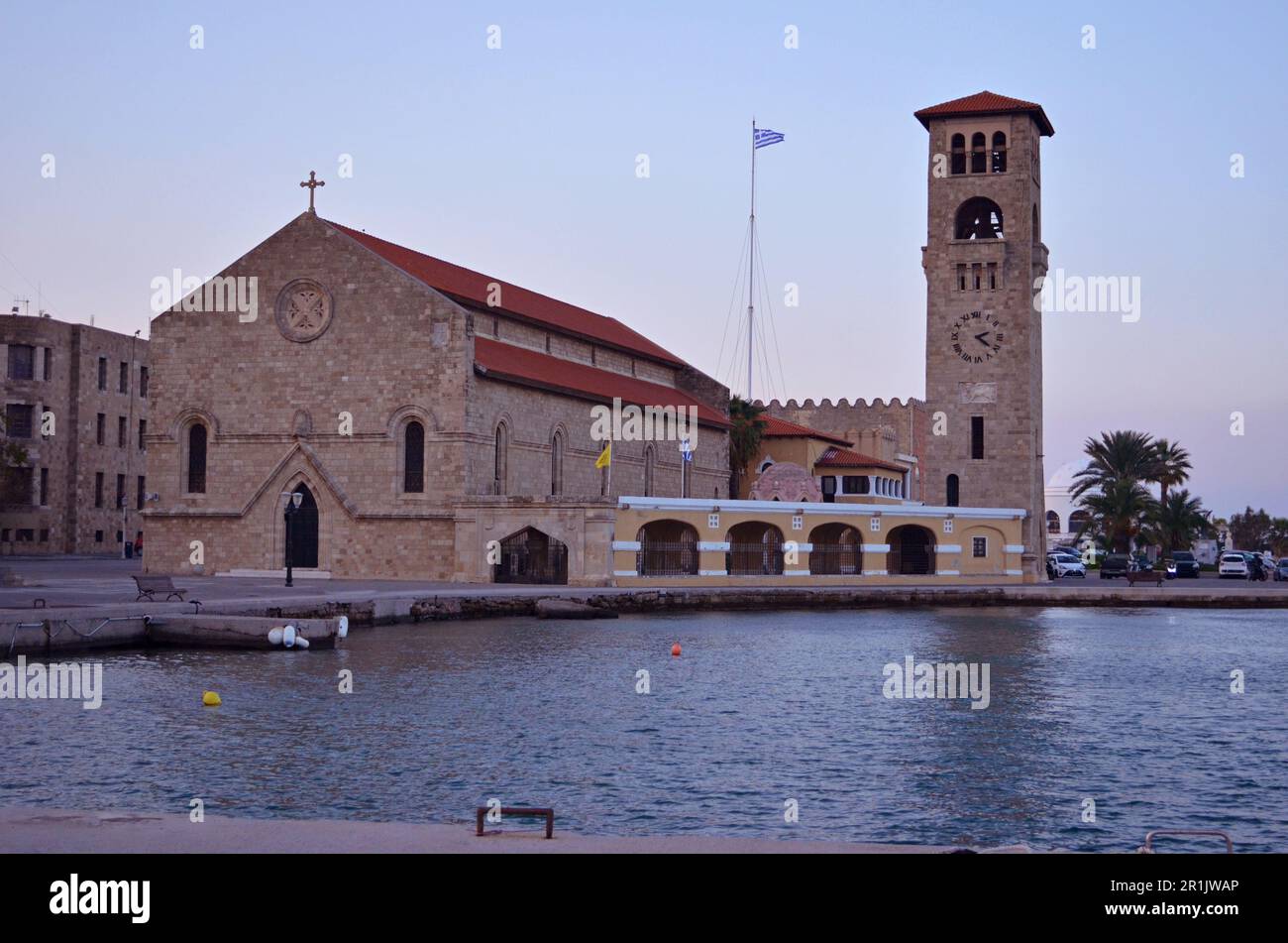 Catholic church in the Gothic style with a bell tower, a cross and a ...