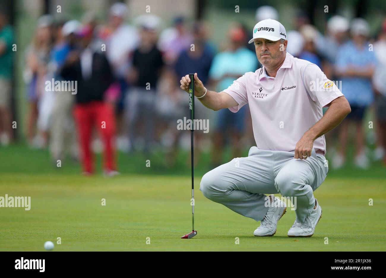 Ryan Palmer lines up a putt the first hole before putting during the ...
