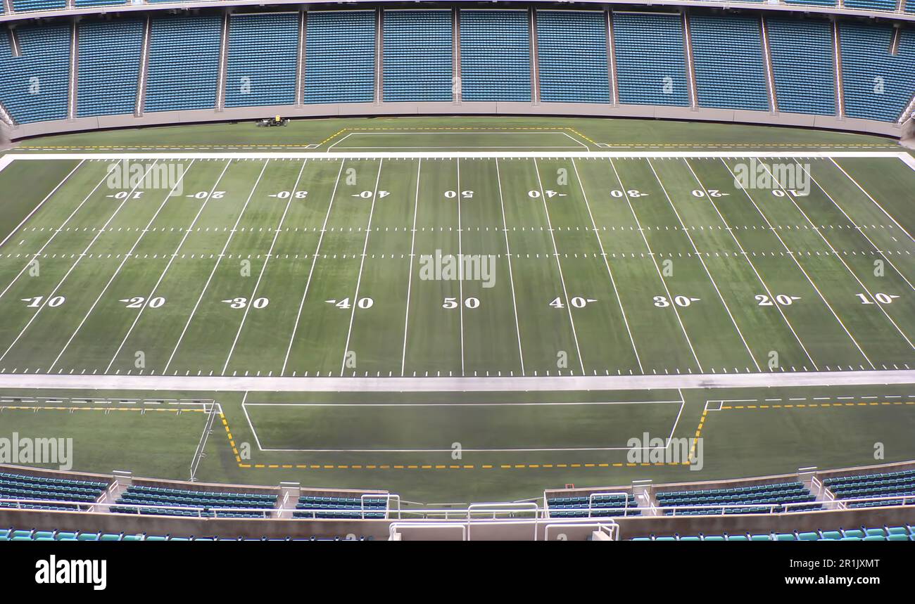 This image shows a large empty grass football field Stock Photo - Alamy