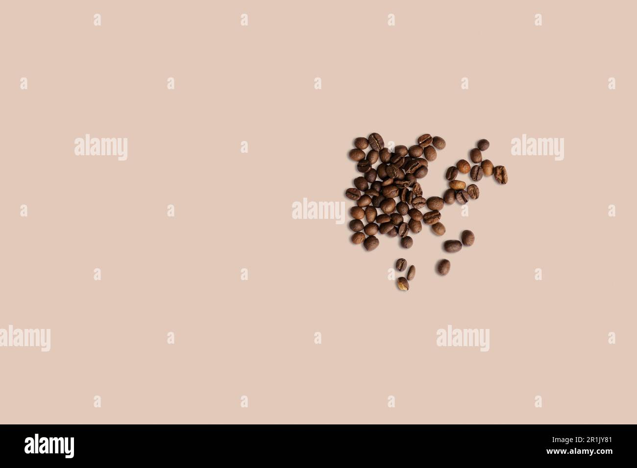 Top up view coffee beans roasted laying on white ground Stock Photo - Alamy