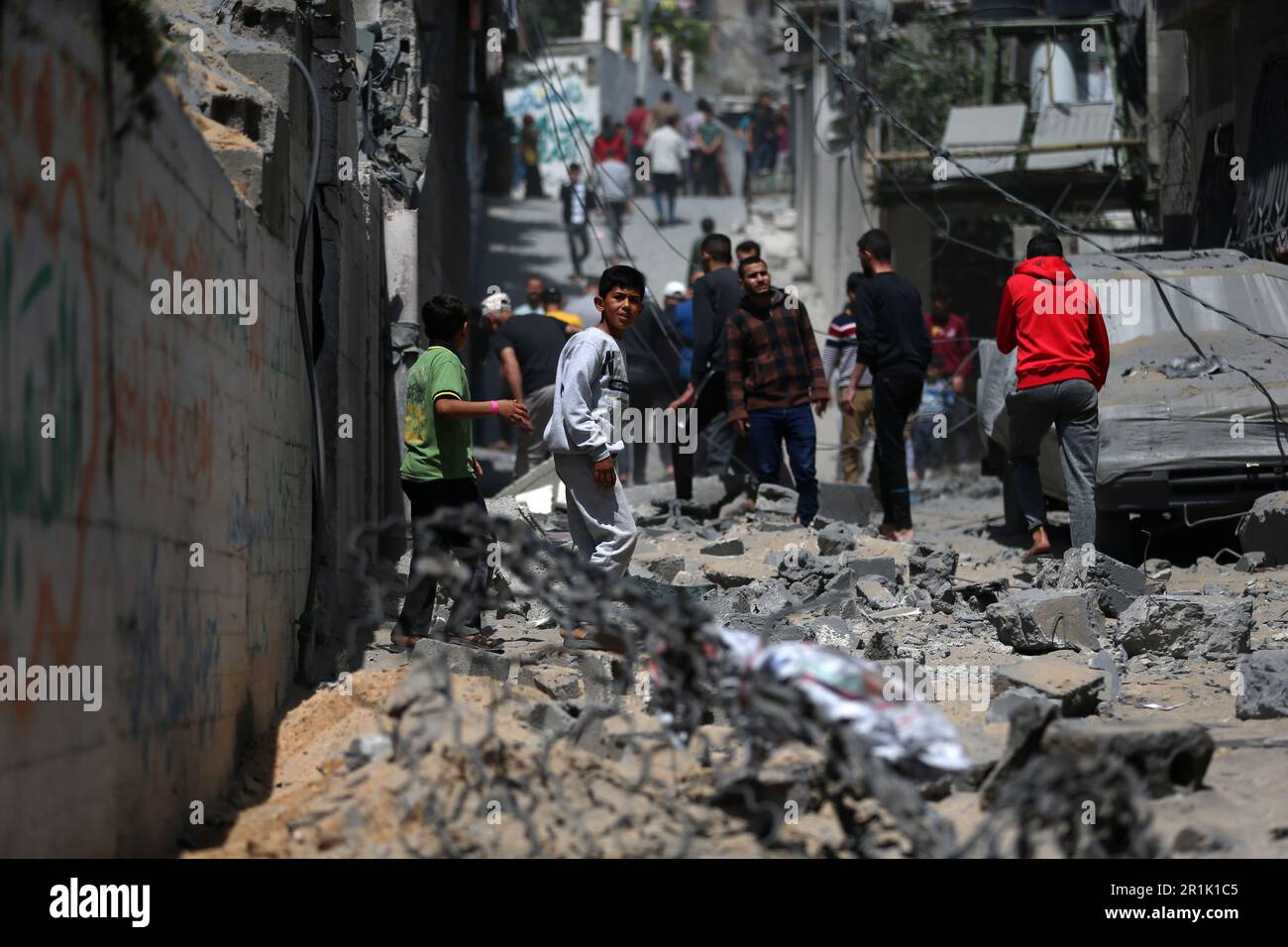 Palestinians are devastated following an Israeli airstrike in Beit ...