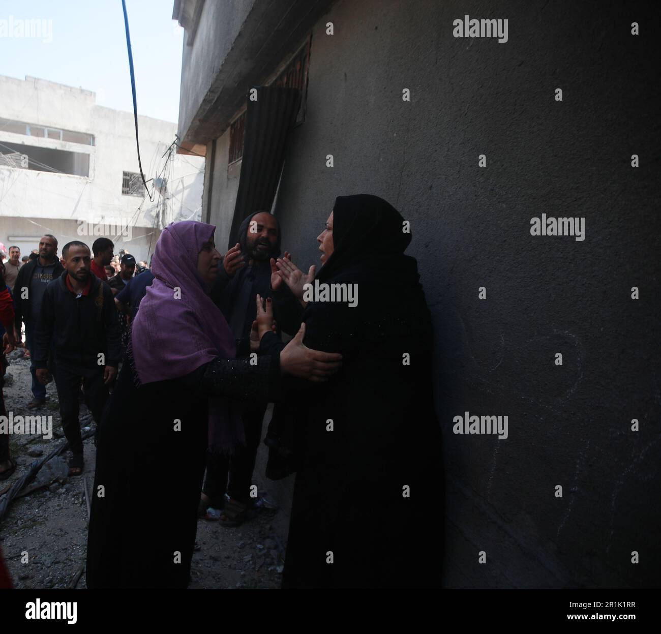 Palestinians are devastated following an Israeli airstrike in Beit ...