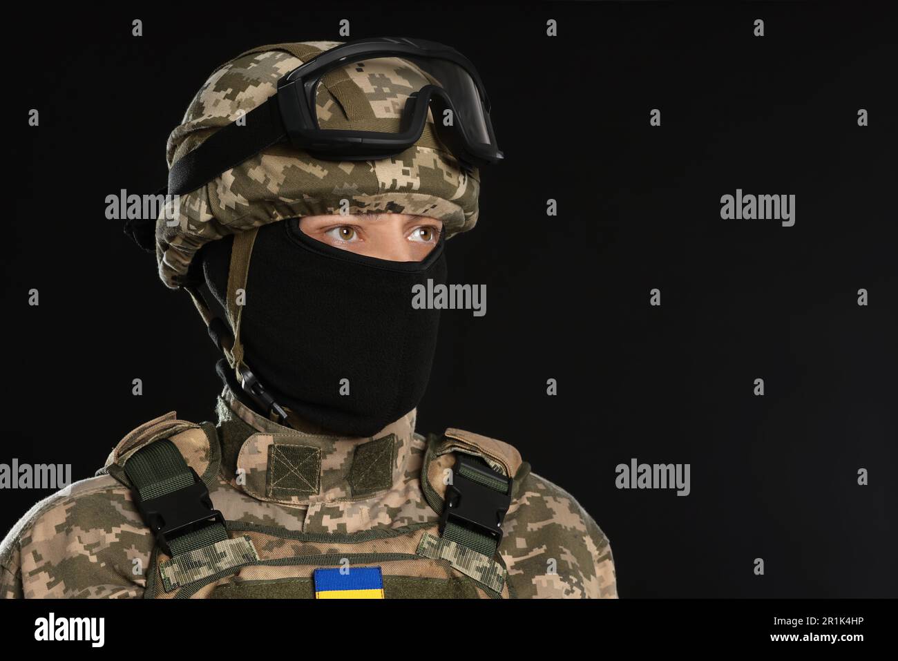 Soldier in Ukrainian military uniform, tactical goggles and balaclava ...