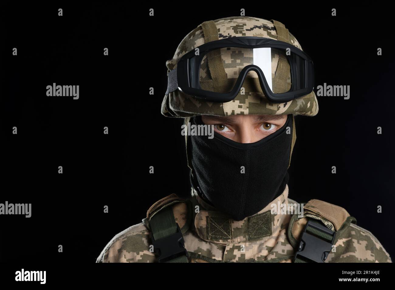 Soldier in Ukrainian military uniform with tactical goggles and ...
