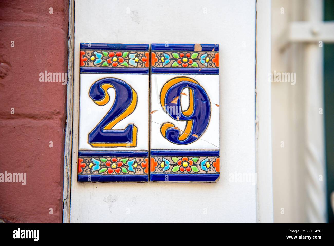 An old porcelain sign with the number 29. Design and renovation concept ...