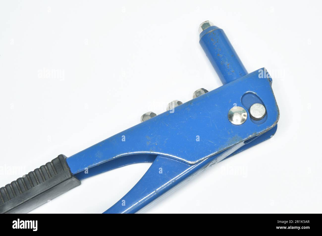 Vintage hand rivet gun isolated on white background Stock Photo - Alamy