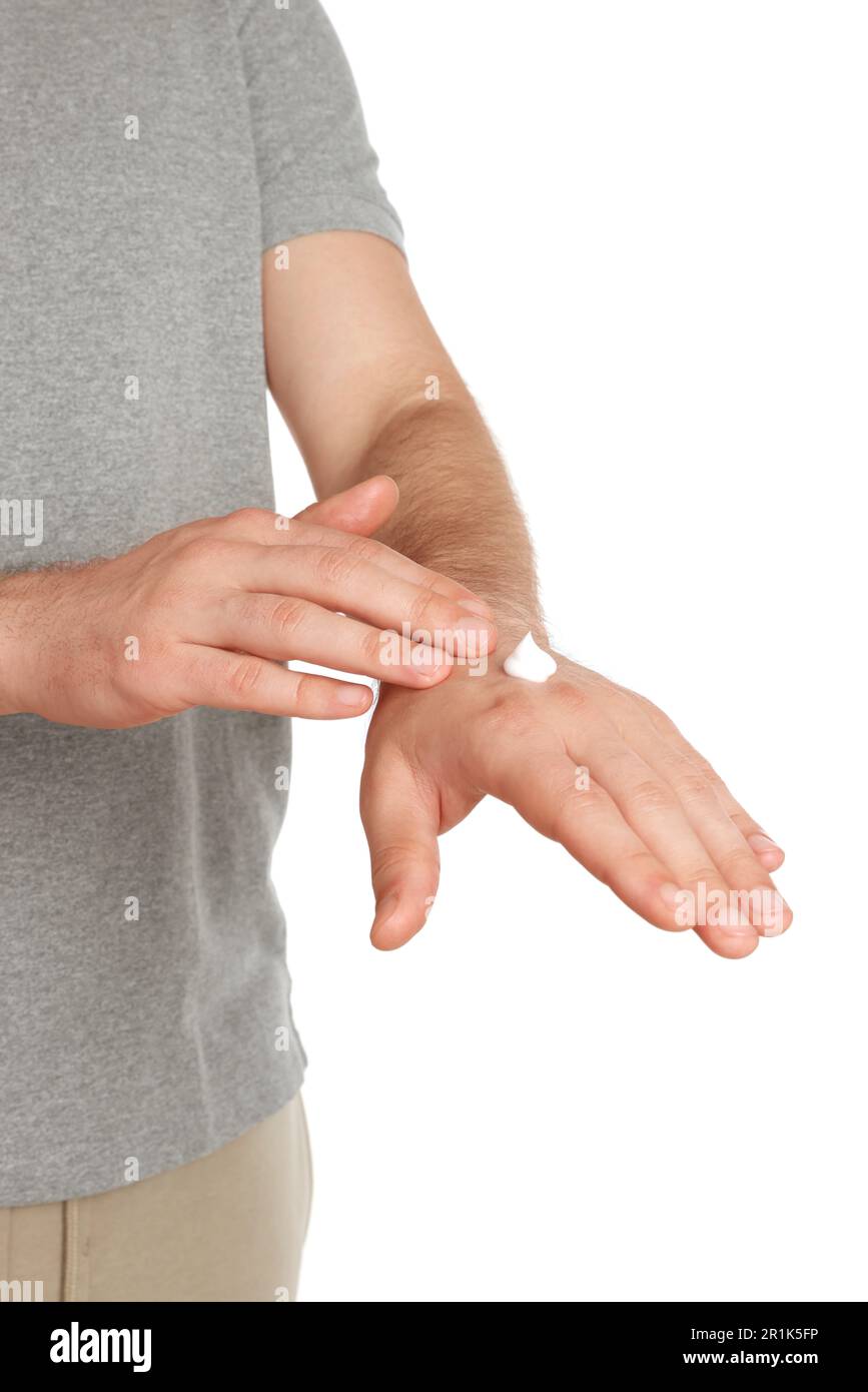 Man applying cream onto hand against white background, closeup Stock ...
