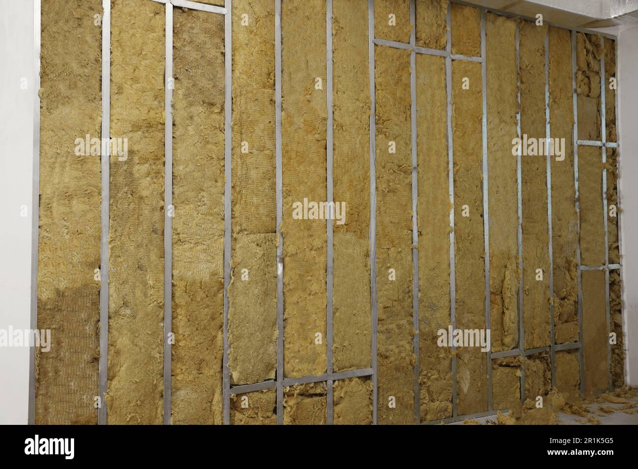 Wall with metal studs and insulation material indoors Stock Photo - Alamy