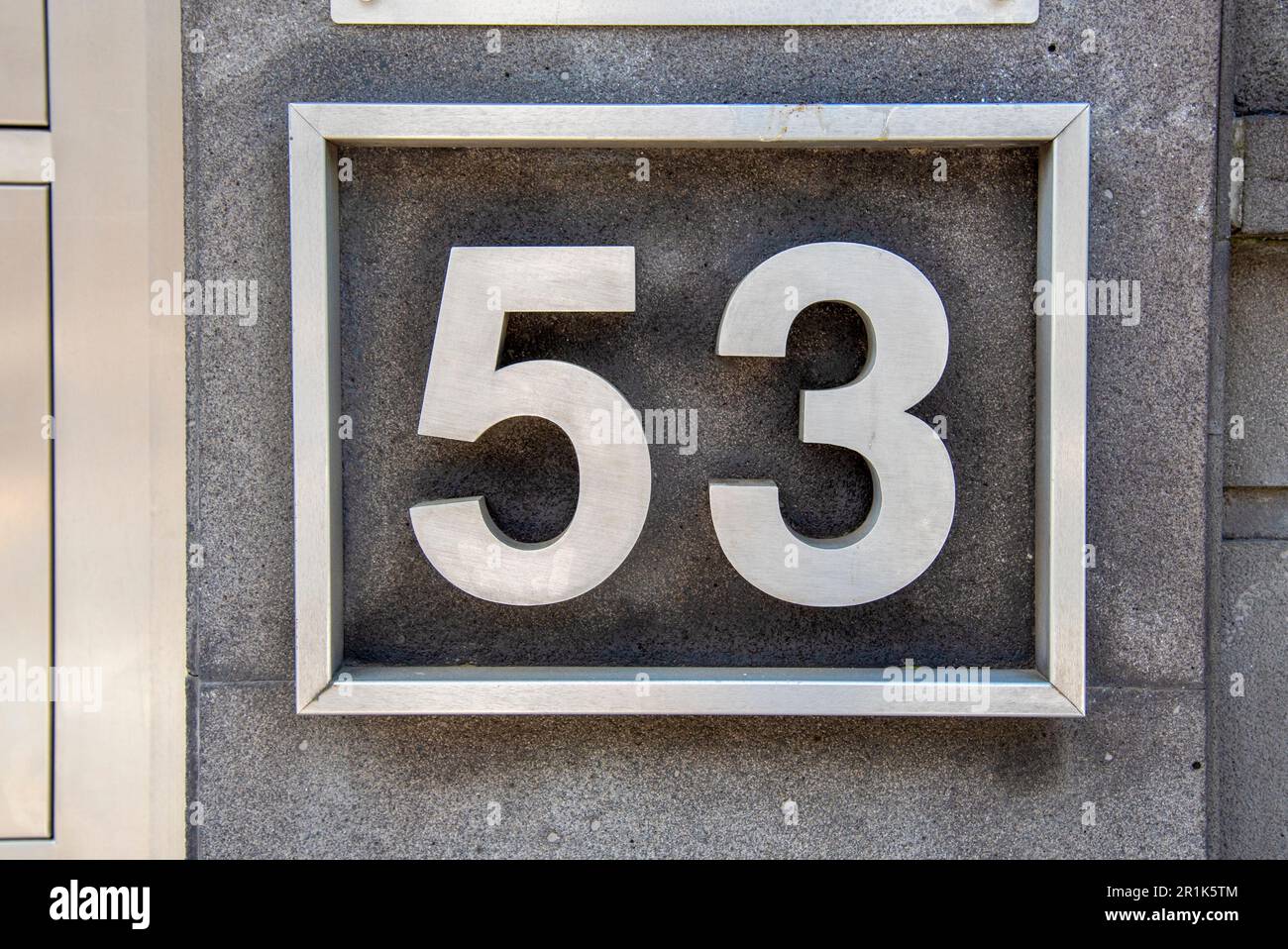 The plate with the number 53 is made of metal. Design and construction ...