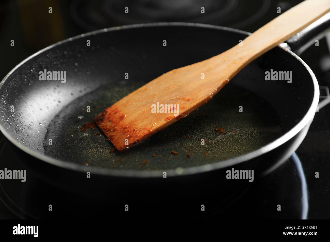 Frying pan with spatula and used cooking oil on stove, closeup Stock ...