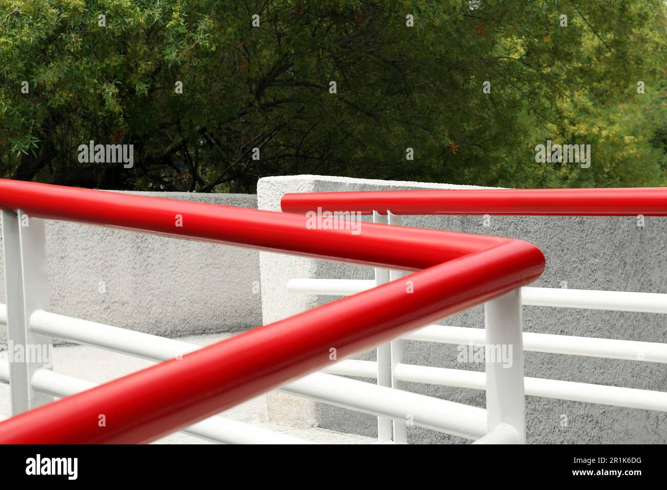 Ramp with red metal handrailings near trees outdoors Stock Photo - Alamy