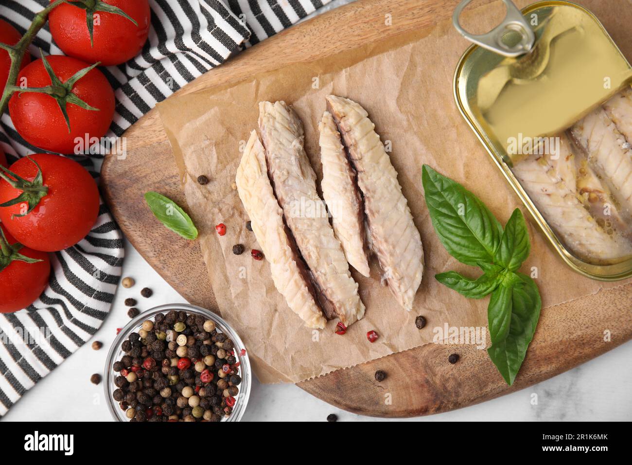 Canned mackerel fillets served on white marble table, flat lay Stock ...
