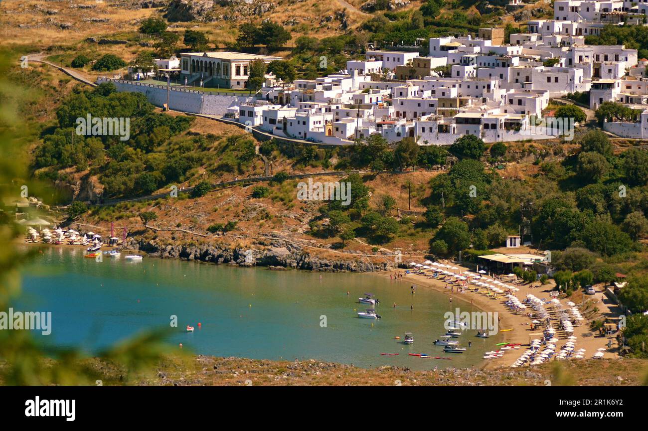 Panorama of the Greek village of Lindos with white houses and green ...
