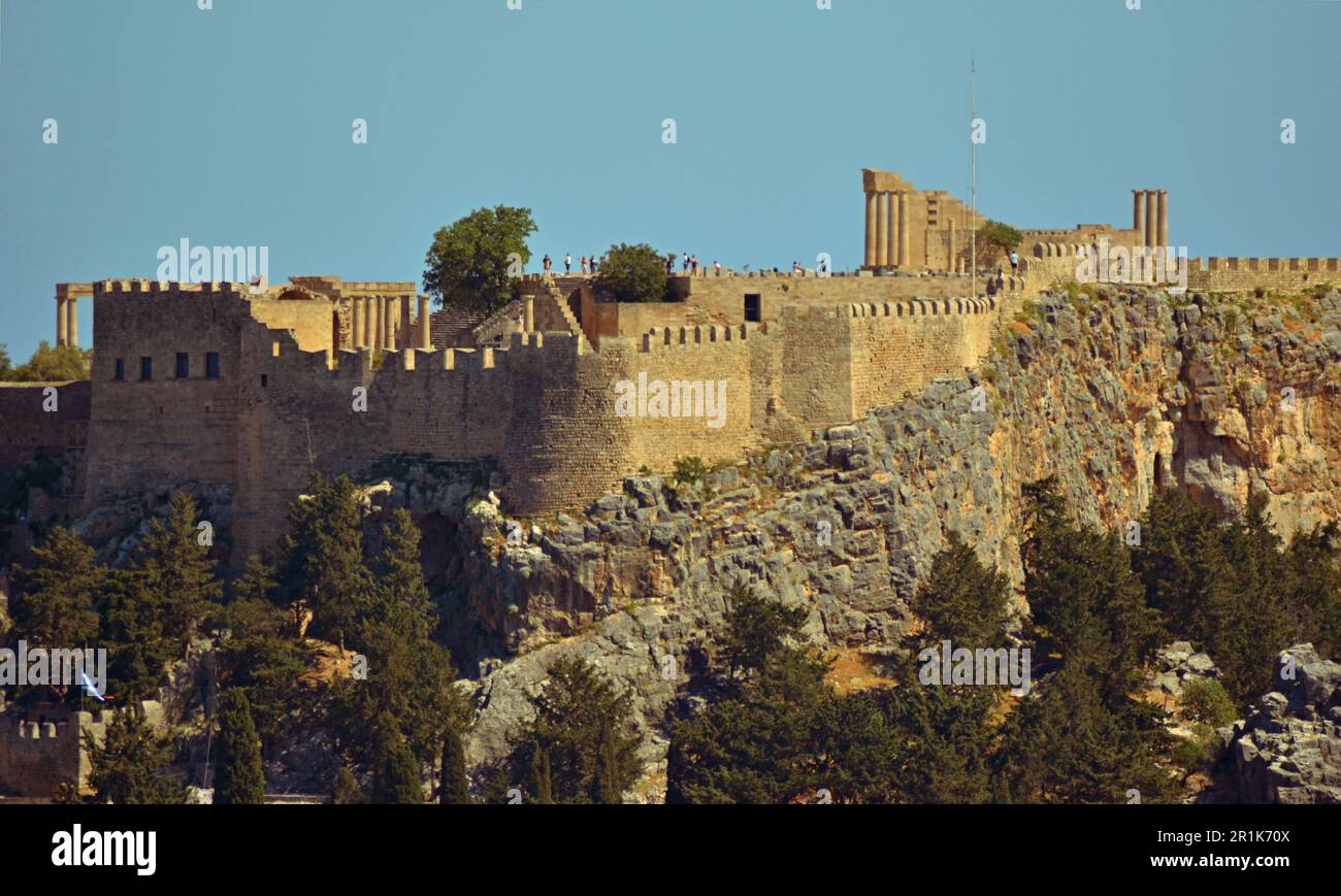 The ancient Acropolis of the goddess Athena in the village of Lindos on ...